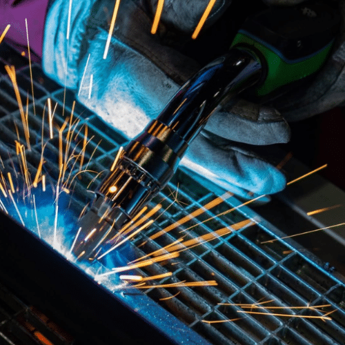 What toxic substance is released when welding stainless steel?